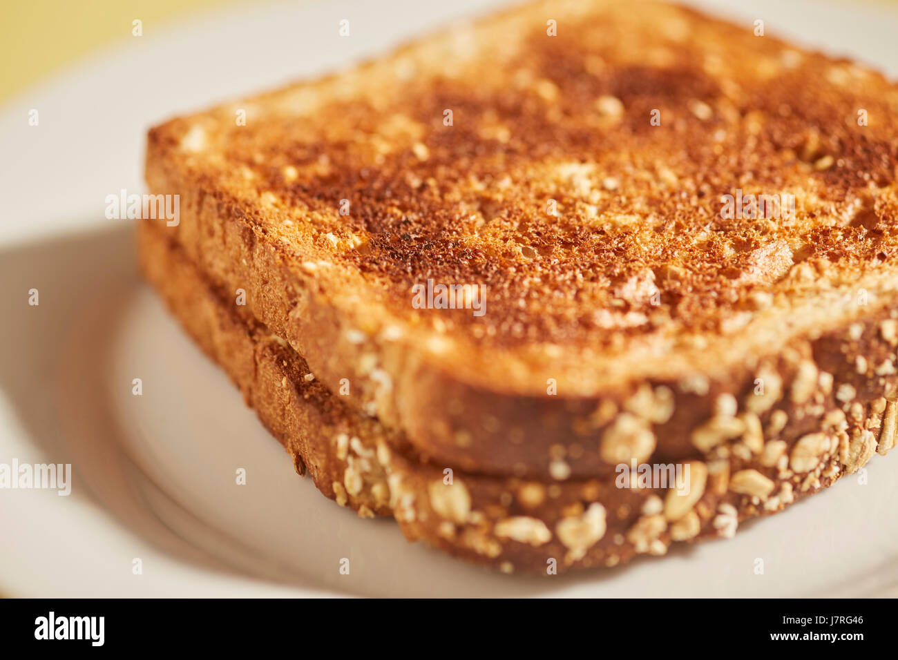two slices of whole grain toast Stock Photo - Alamy