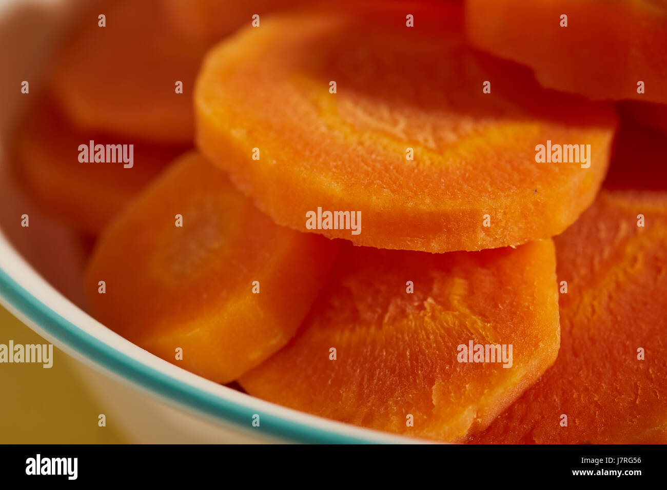poached sliced carrots, sometimes called carrot coins Stock Photo - Alamy
