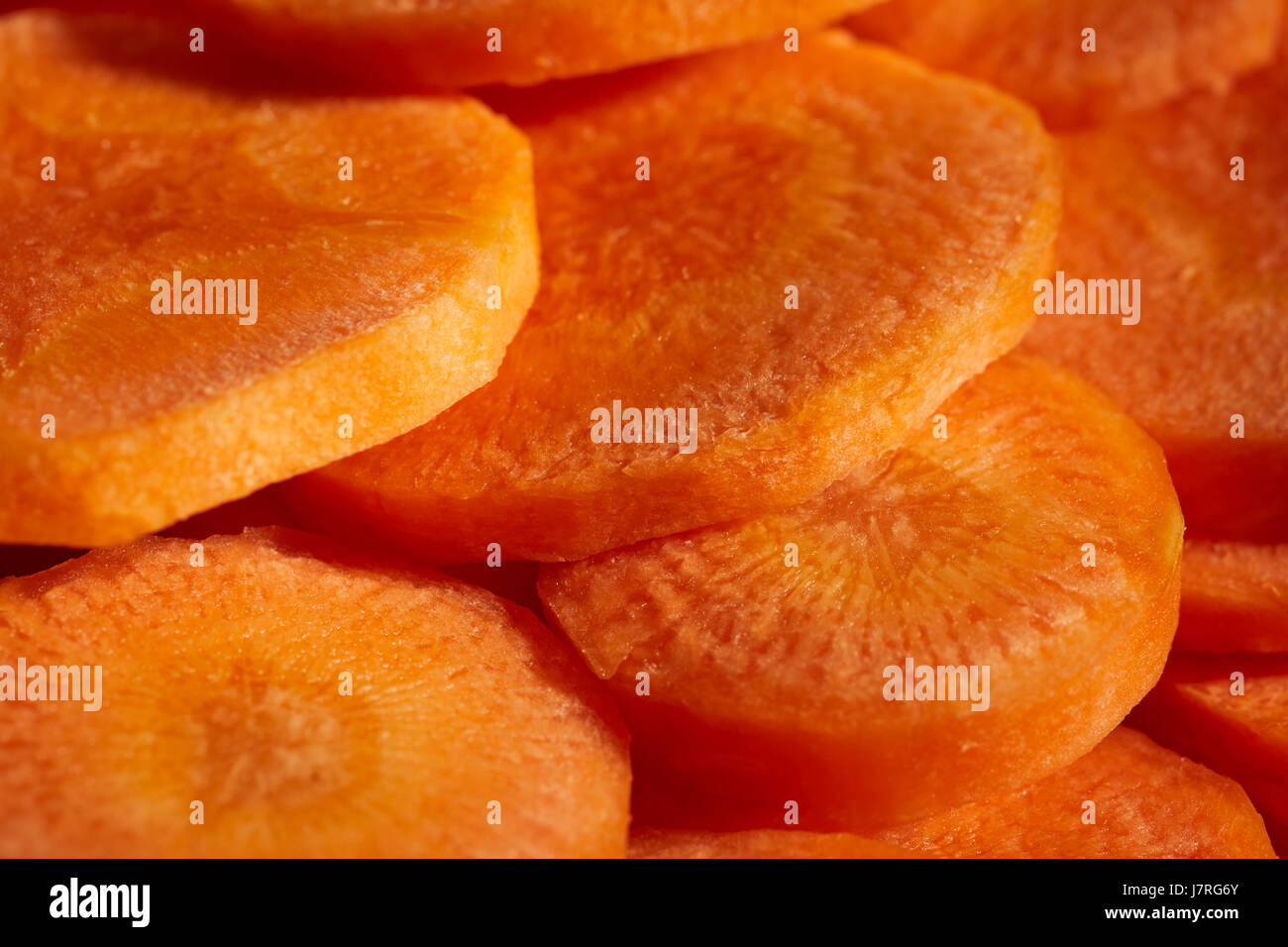 sliced raw carrots, sometimes called carrot coins Stock Photo - Alamy