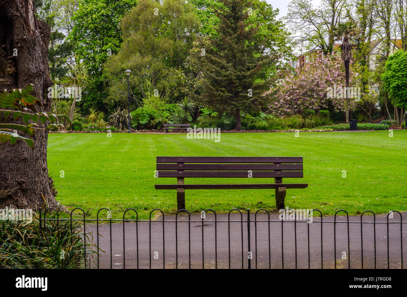 Urban park with brook, wonderful resting place, wooden benches, shrubs ...