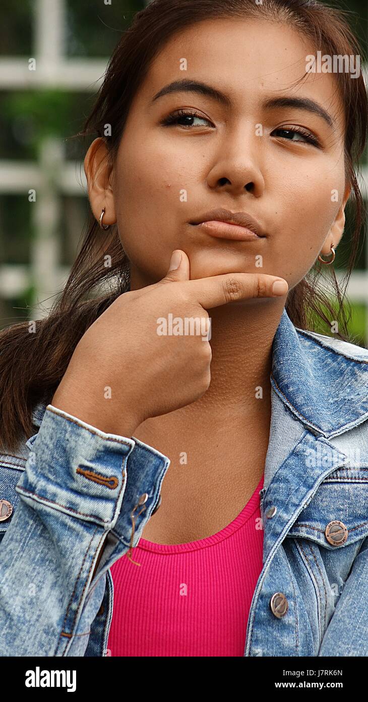 Diverse Teenage Girl Thinking Stock Photo - Alamy