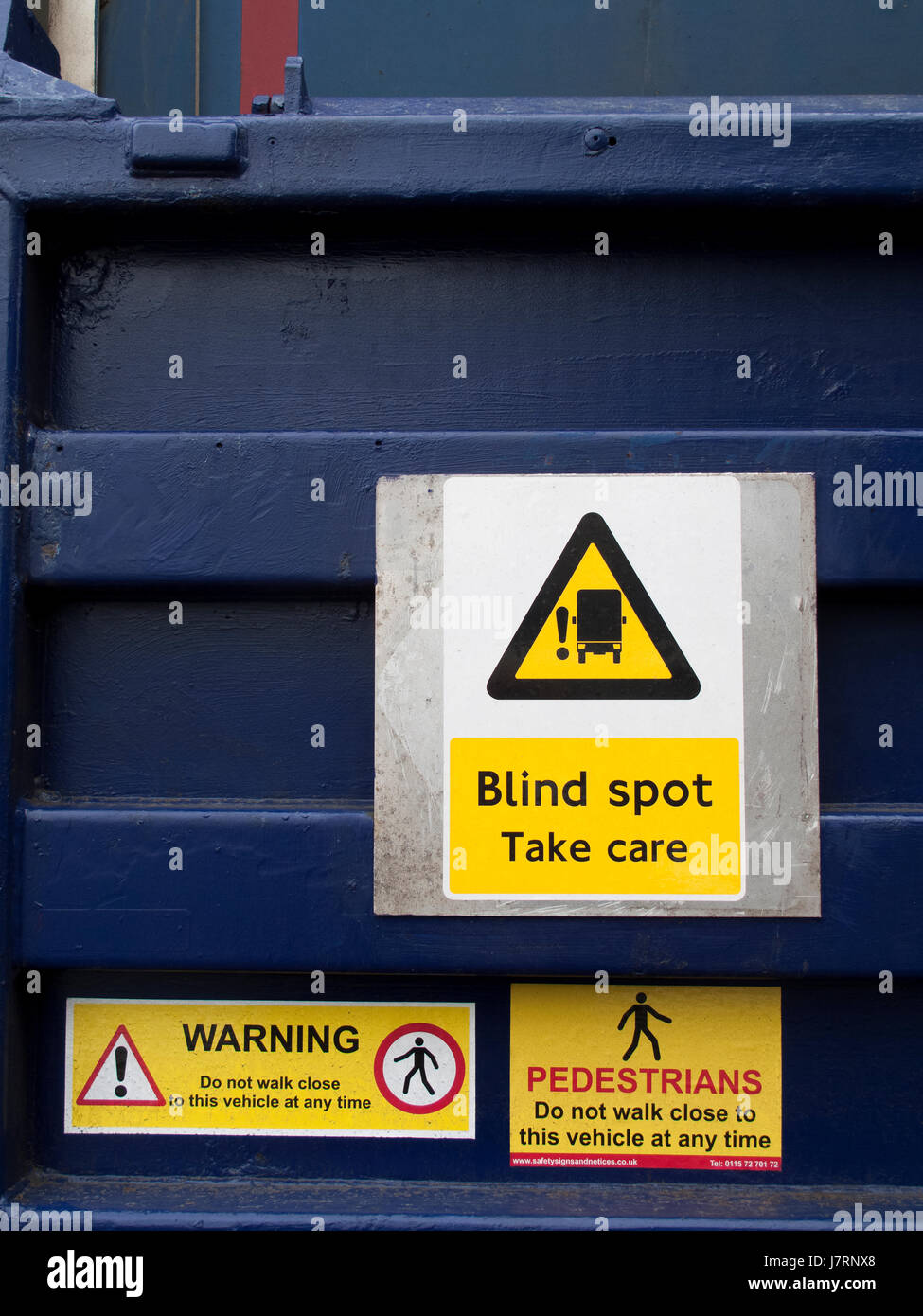 Signs on back of heavy goods vehicle warning pedestrians Stock Photo ...