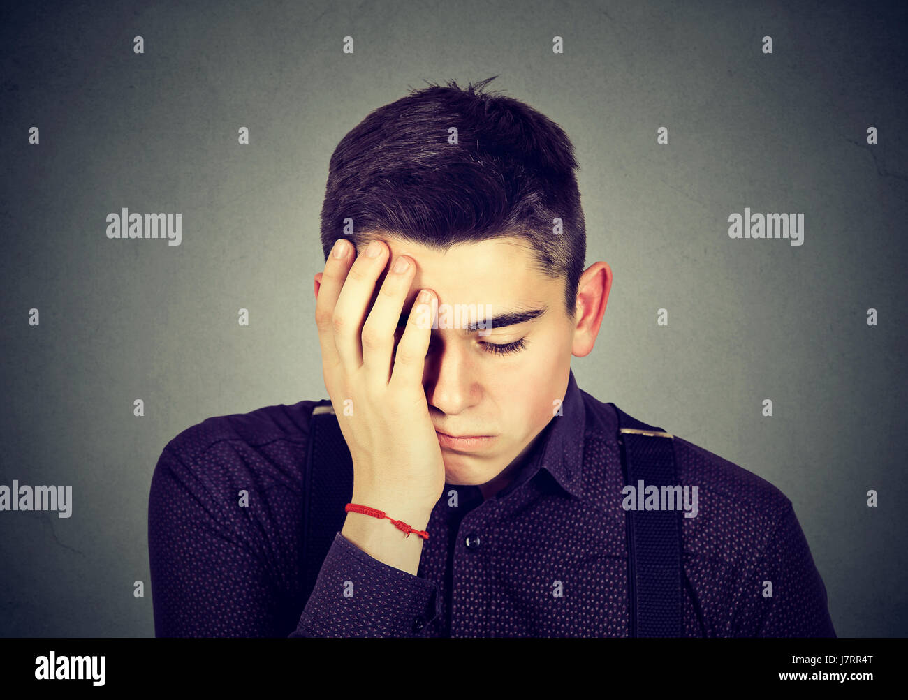 portrait of a sad man looking down Stock Photo - Alamy