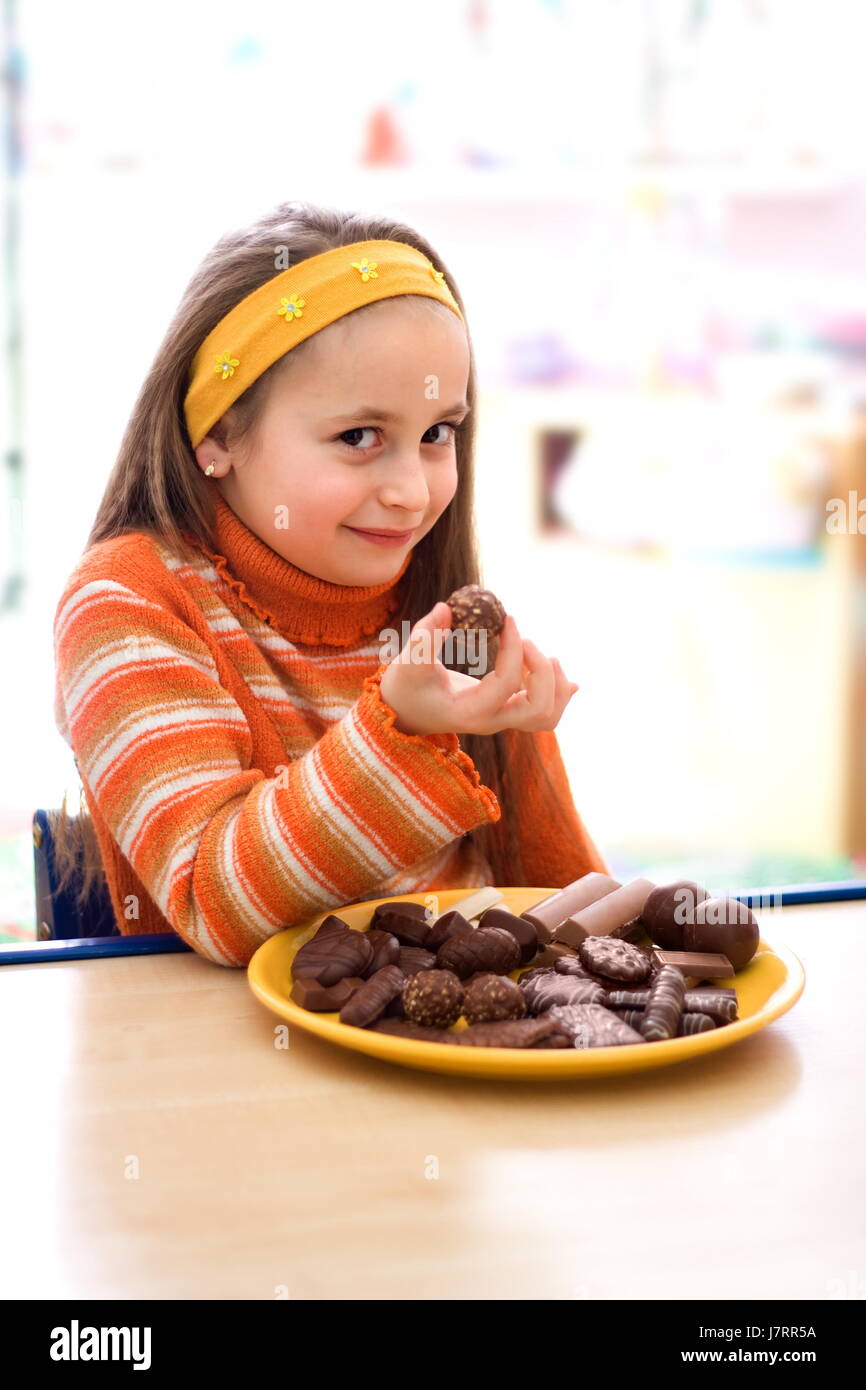 small tiny little short eating eat eats girl girls dessert chocolate ...