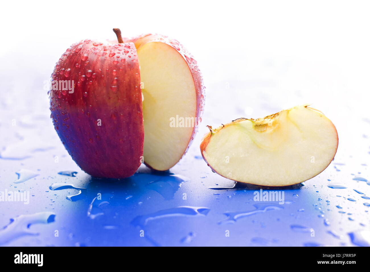 blue fruit drop quarter slice apple water drip drops seeping sopping ...