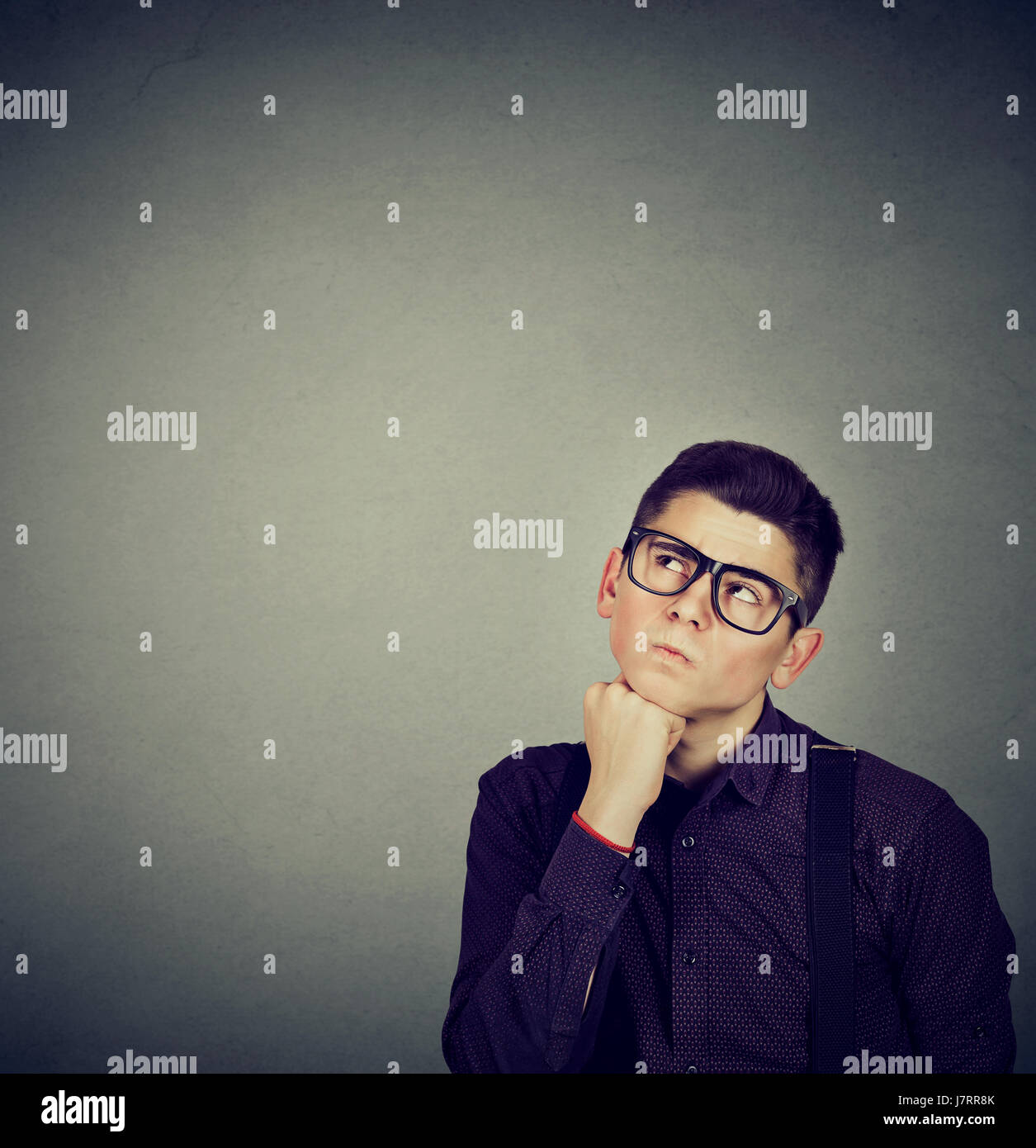 Thoughtful man thinking making up his mind looking up Stock Photo - Alamy