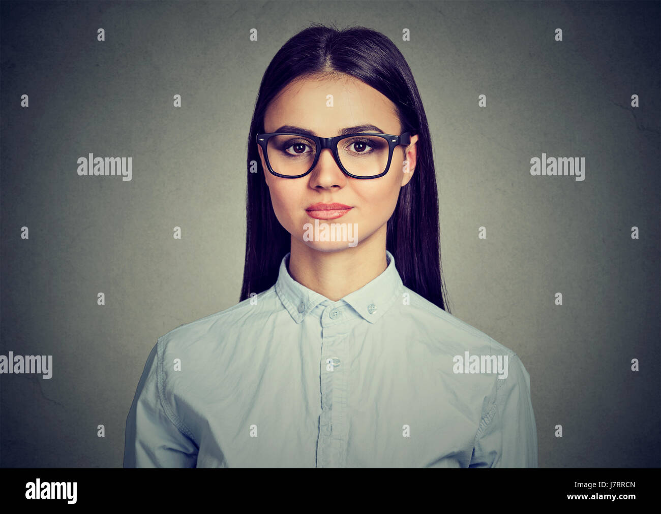 Portrait of a serious young woman Stock Photo - Alamy