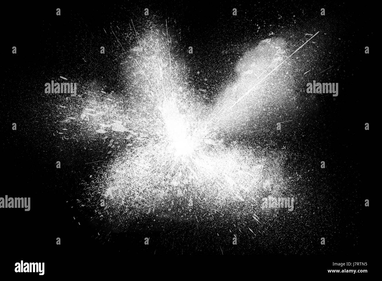 Freeze motion of white powder exploding, isolated on black, dark ...