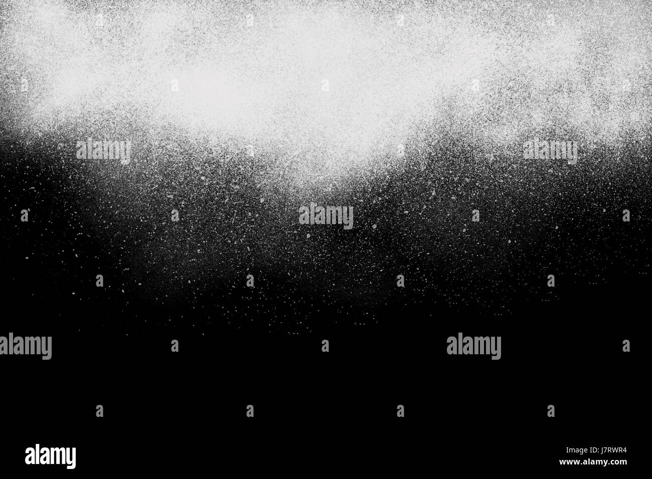 Freeze motion of white powder falling, isolated on black, dark ...