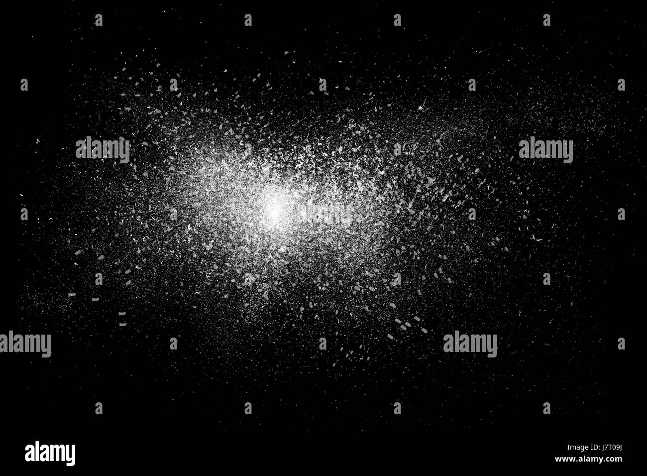 Freeze motion of white powder exploding, isolated on black, dark ...