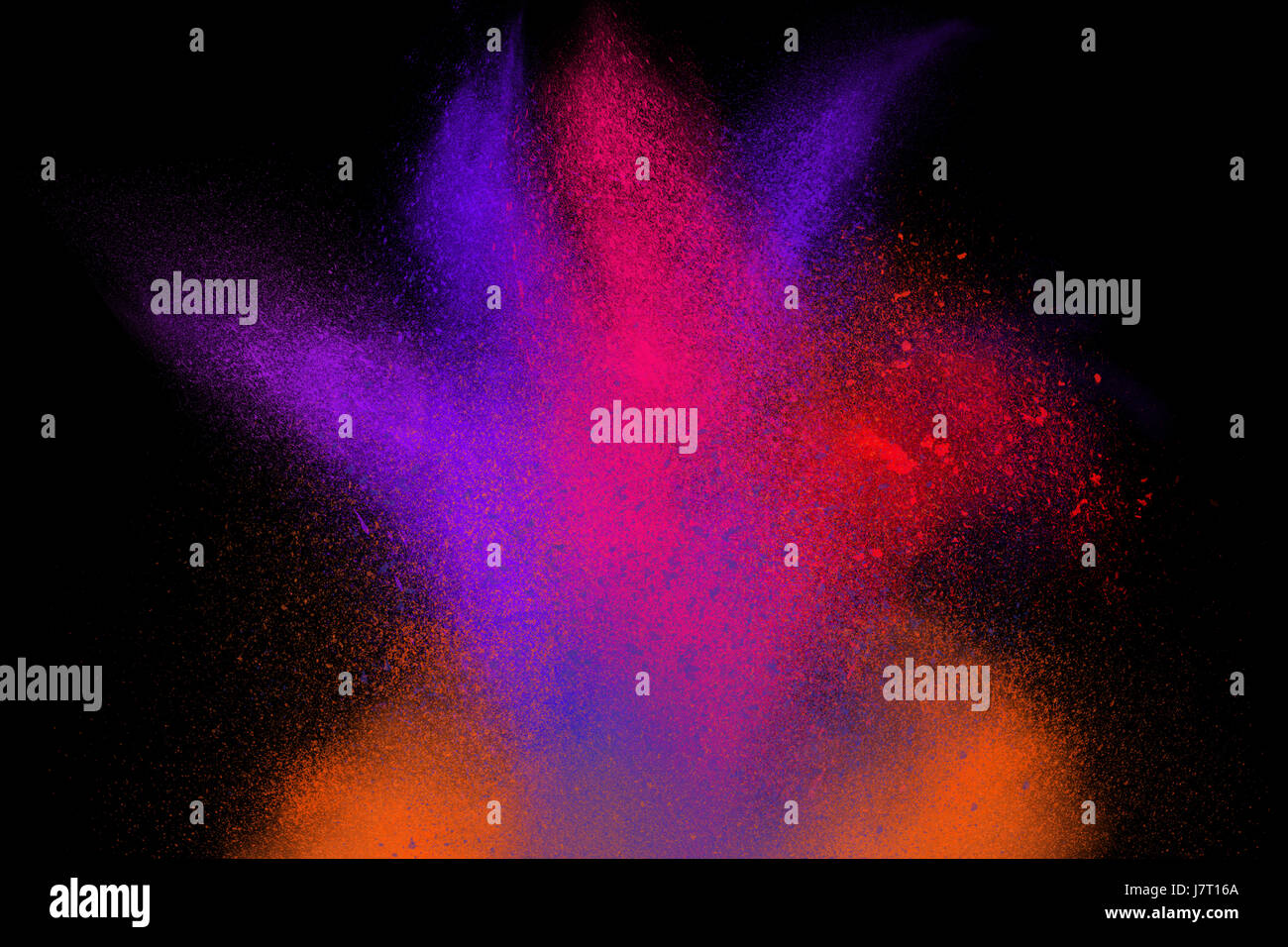 Freeze motion of colorful powder exploding isolated on black, dark ...