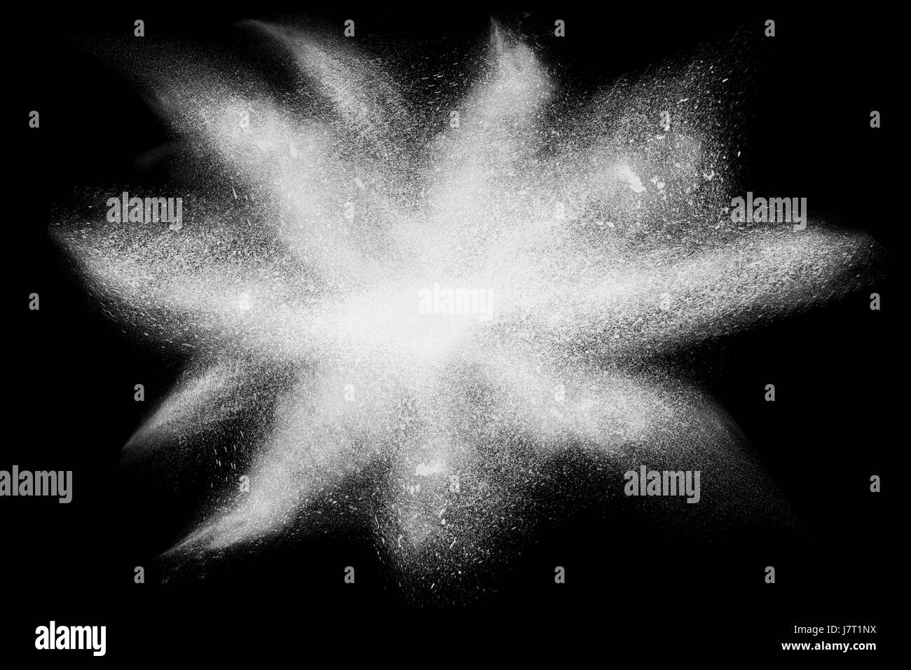 Freeze motion of white powder exploding, isolated on black, dark ...
