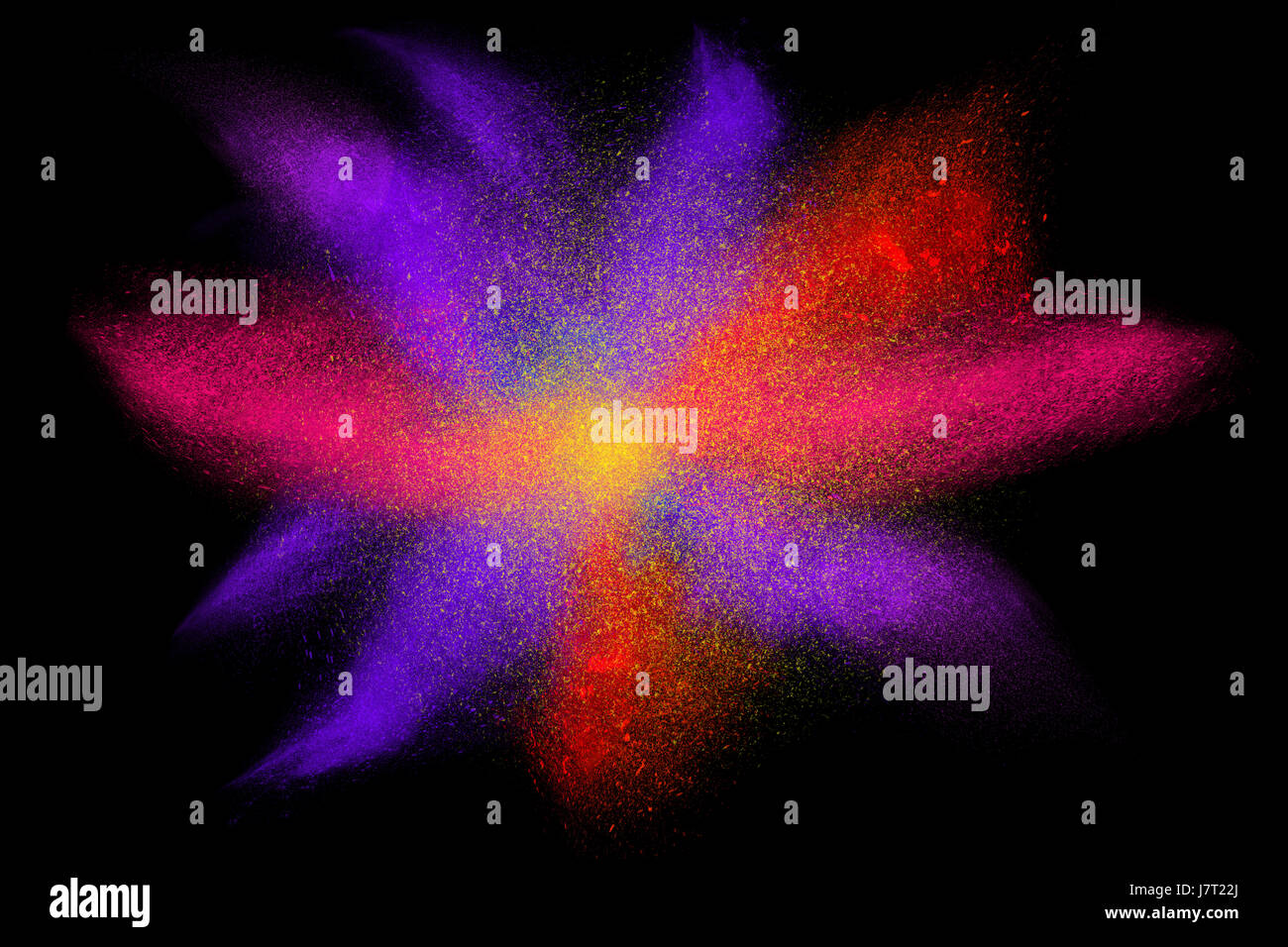 Freeze motion of colorful powder exploding isolated on black, dark ...