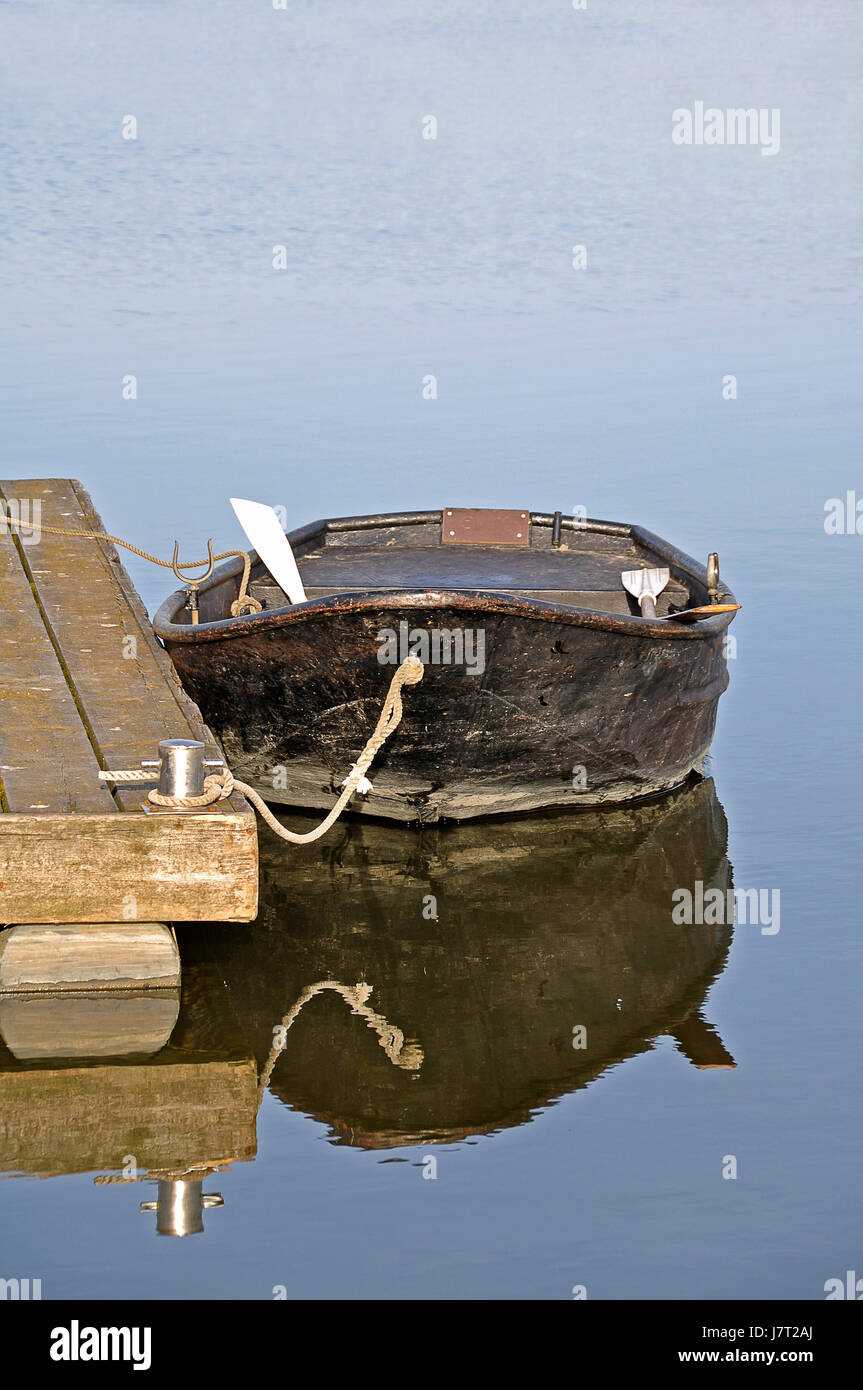black swarthy jetblack deep black investor boat arranged rowing boat ...