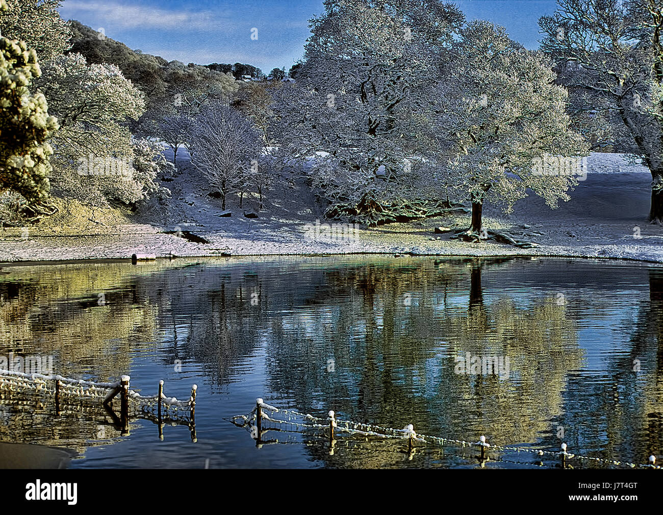 A snowy winter scene across Calf Close Bay on Derwent Water, near to ...