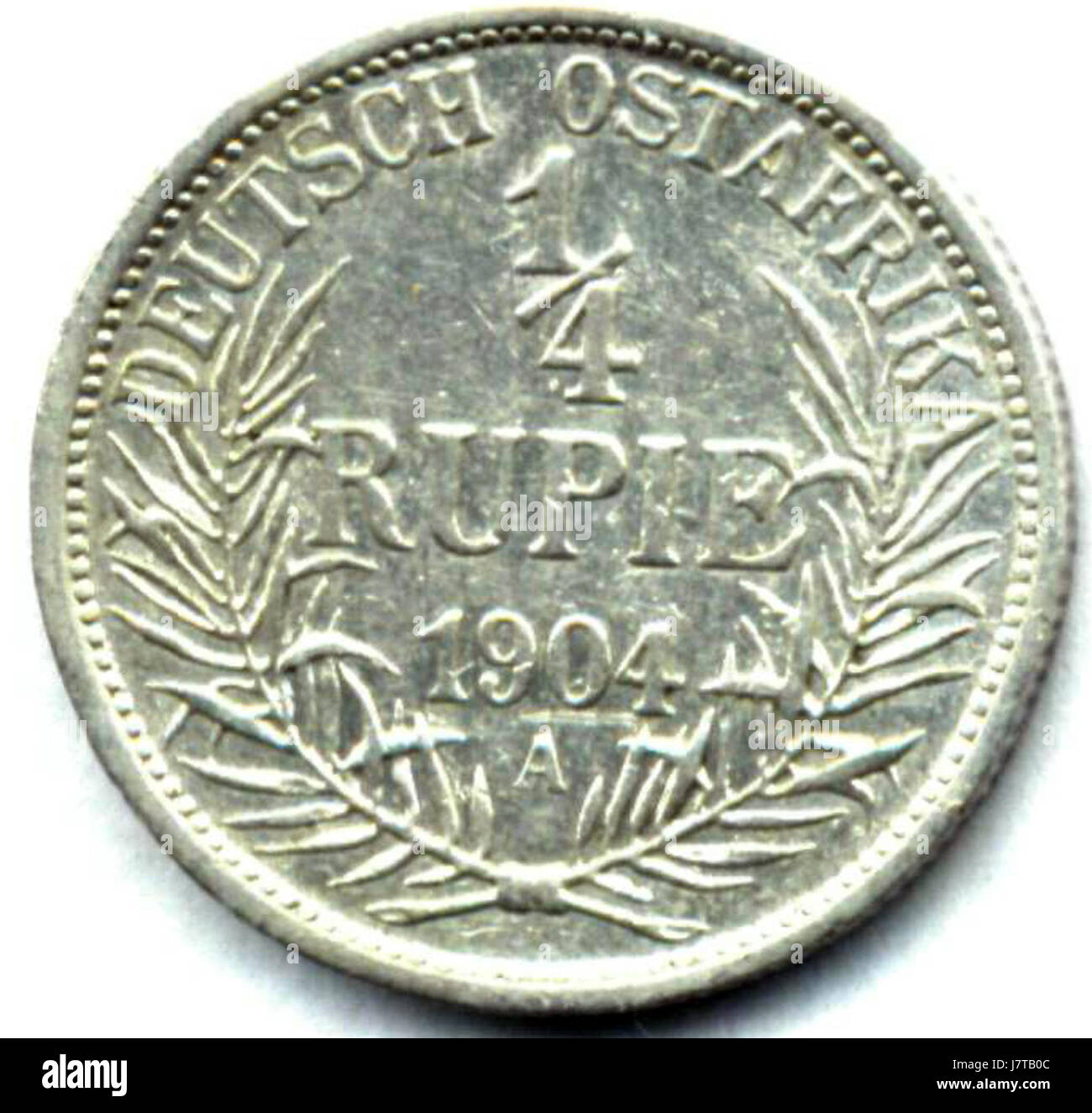 The 1/4 rupie refers to a coin denomination, possibly from a colonial ...