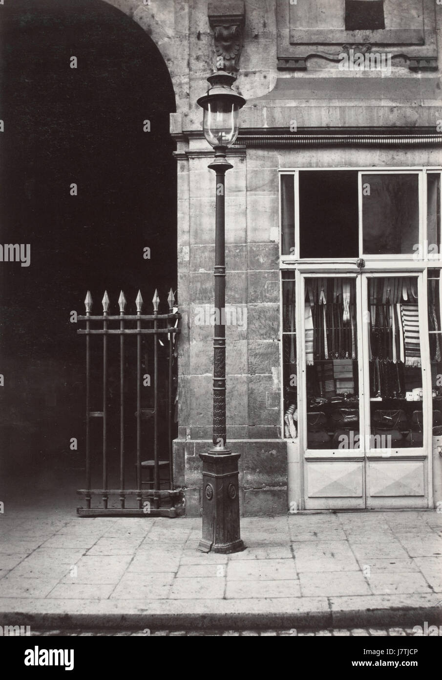 A photograph taken by Charles Marville in 1878, depicting the Cour des ...