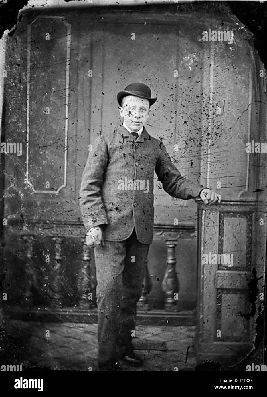 A portrait or image of a young man standing, captured in a specific ...