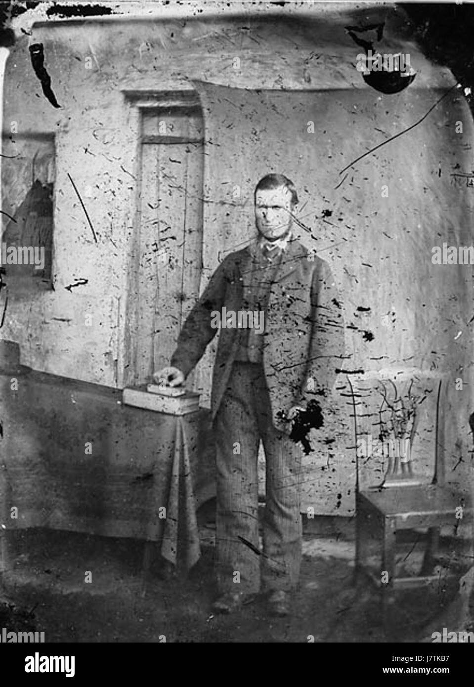 [a man standing table Black and White Stock Photos & Images - Alamy