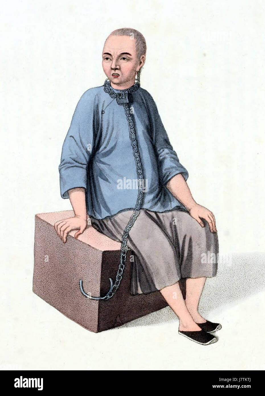 This image depicts a man secured to a block of wood, which may ...