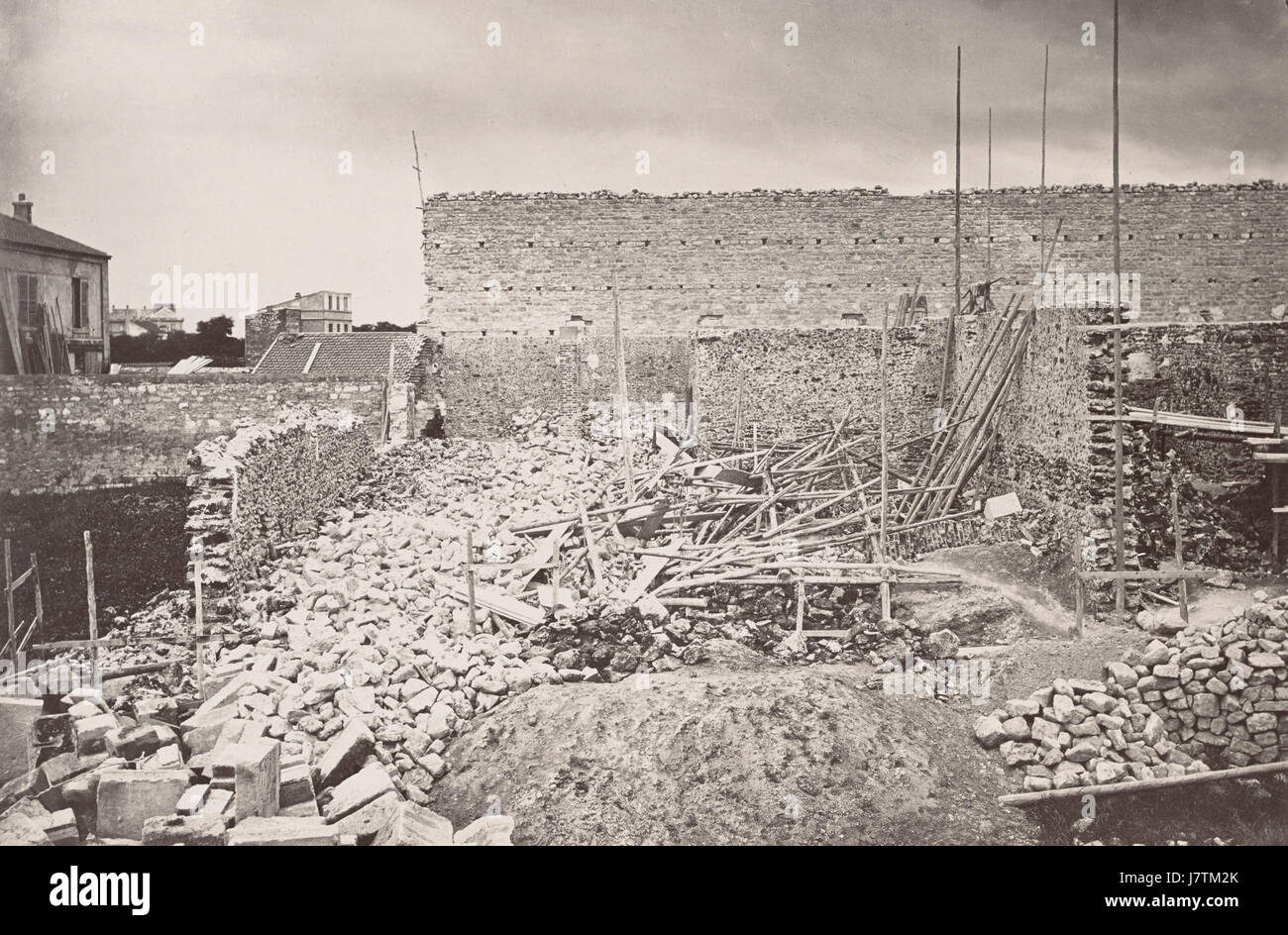 This image depicts the aftermath of a collapsed building, showcasing ...