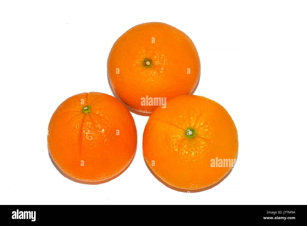 Three whole oranges isolated on white background Stock Photo - Alamy
