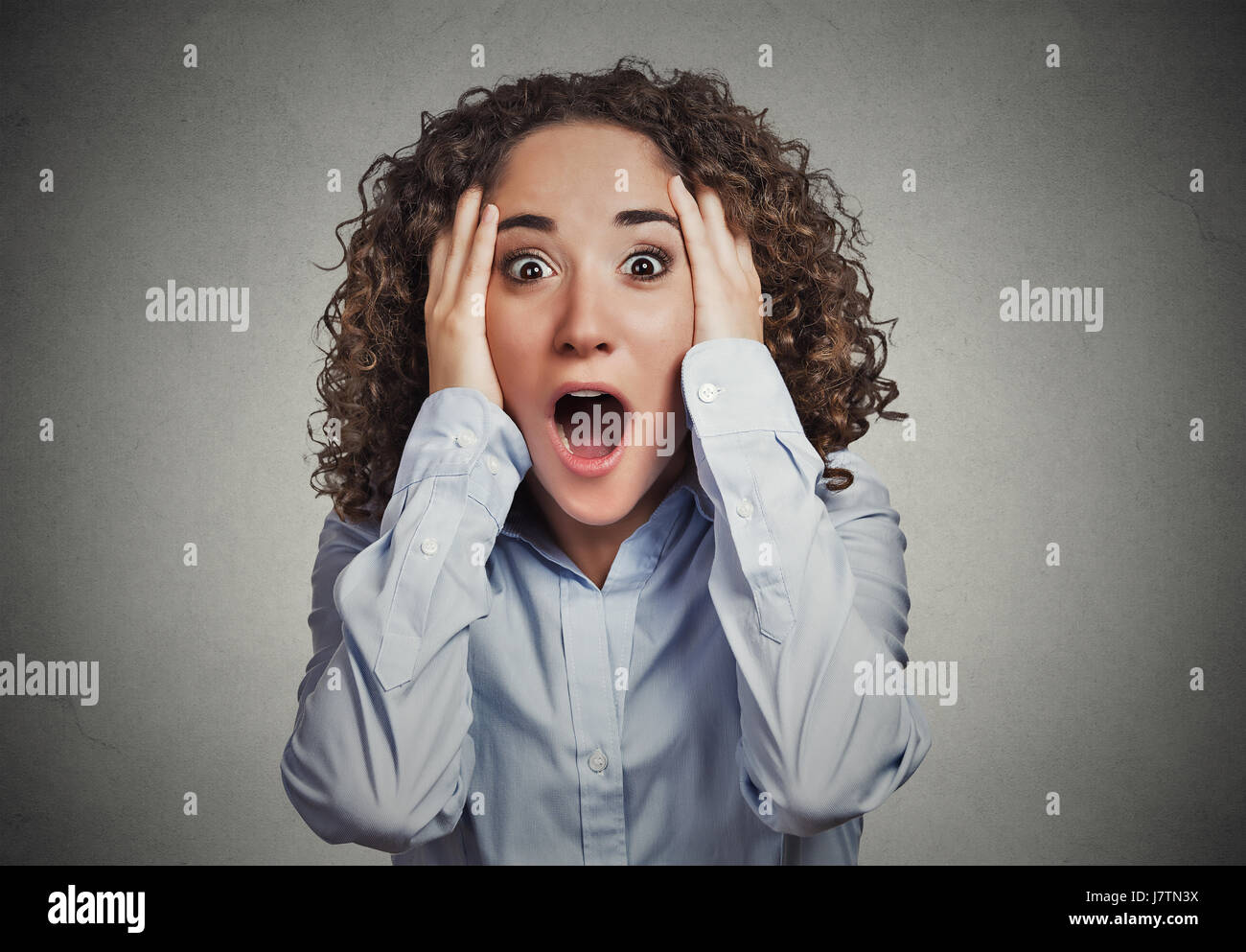Shocked surprised stunned. Closeup portrait happy young woman looking ...