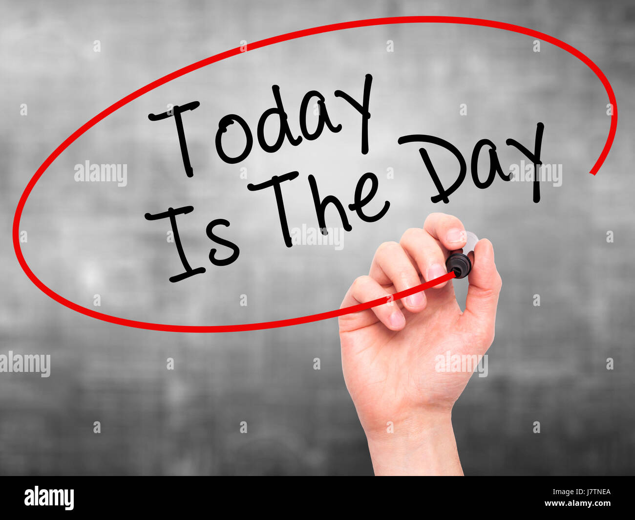 Man Hand writing Today Is The Day with black marker on visual screen ...