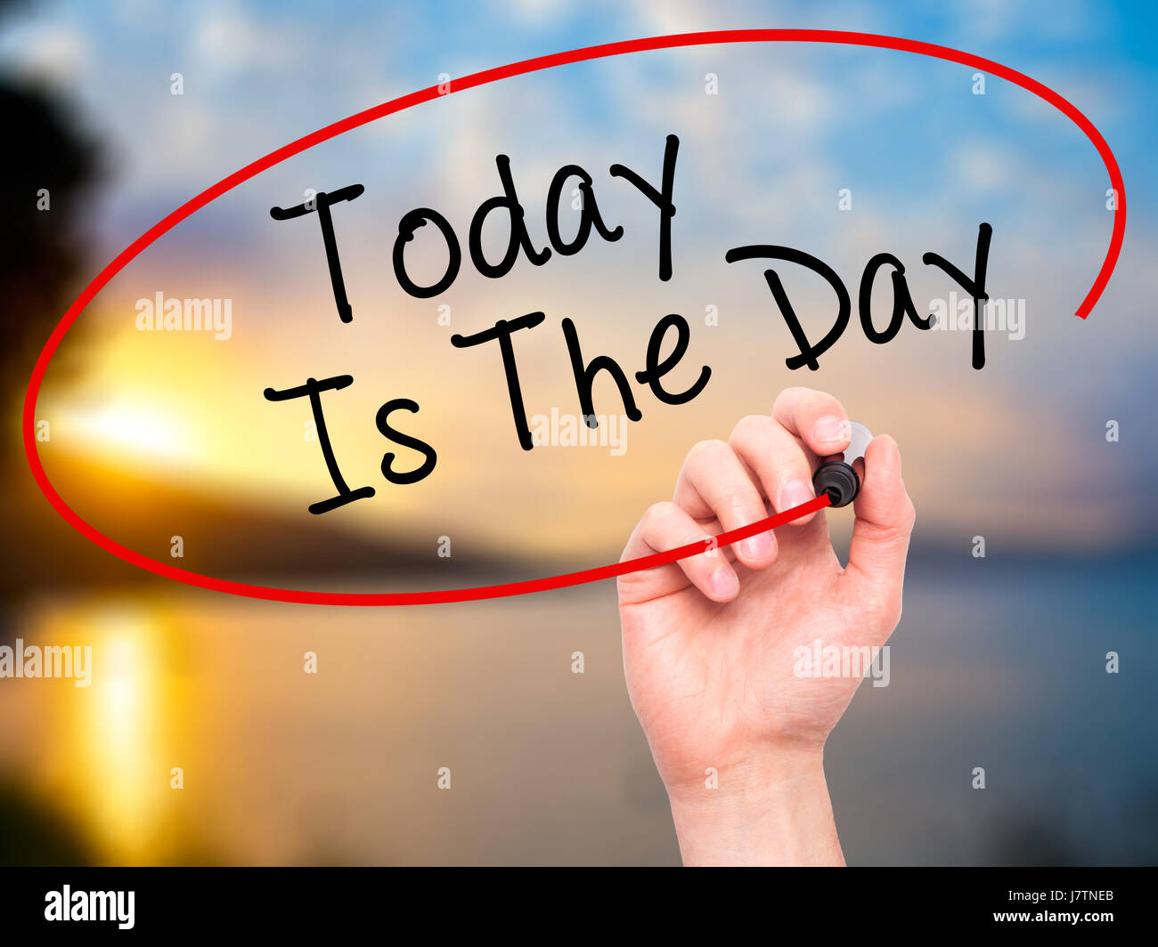 Man Hand writing Today Is The Day with black marker on visual screen ...