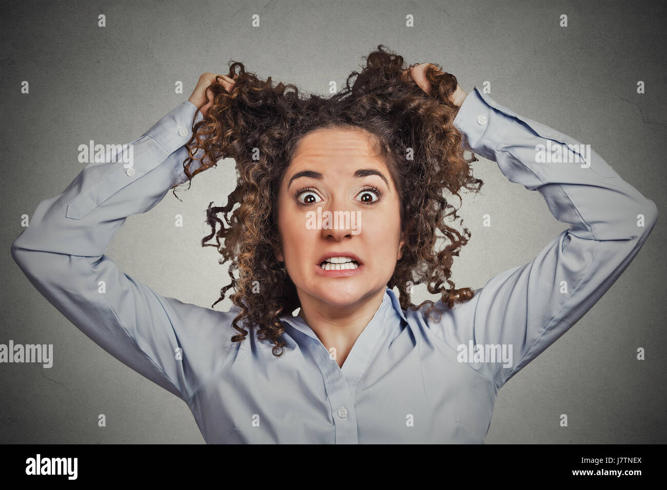 Closeup portrait stressed, frustrated shocked business woman pulling ...