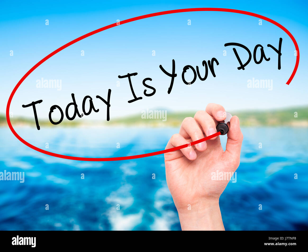 Man Hand writing Today Is Your Day with black marker on visual screen ...