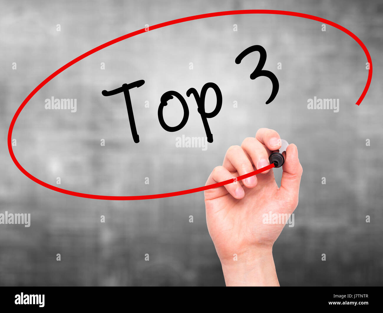 Man Hand writing Top 3 with black marker on visual screen. Isolated on ...