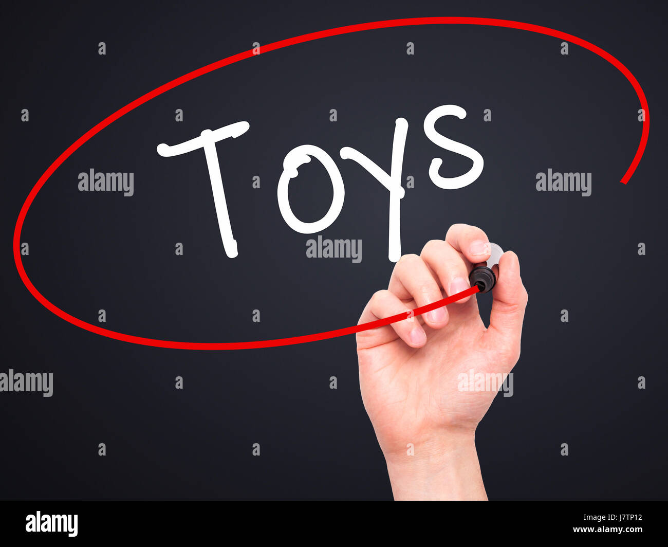 Man Hand writing Toys with black marker on visual screen. Isolated on ...