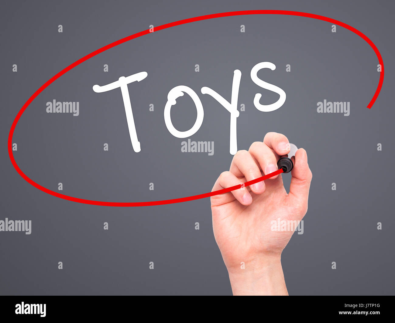 Man Hand writing Toys with black marker on visual screen. Isolated on ...