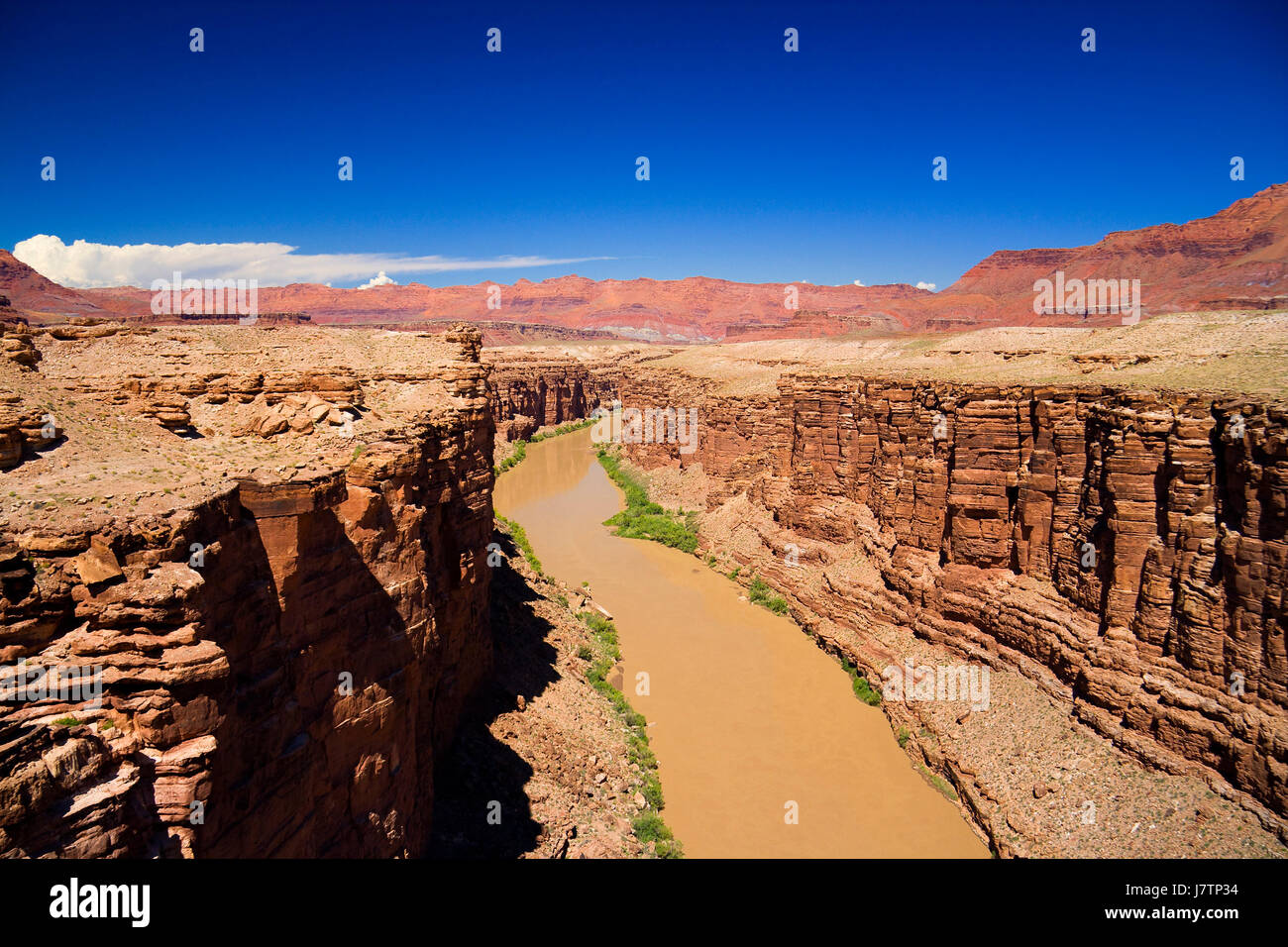 desert wasteland arizona Canyon muddy red river water blue beautiful ...