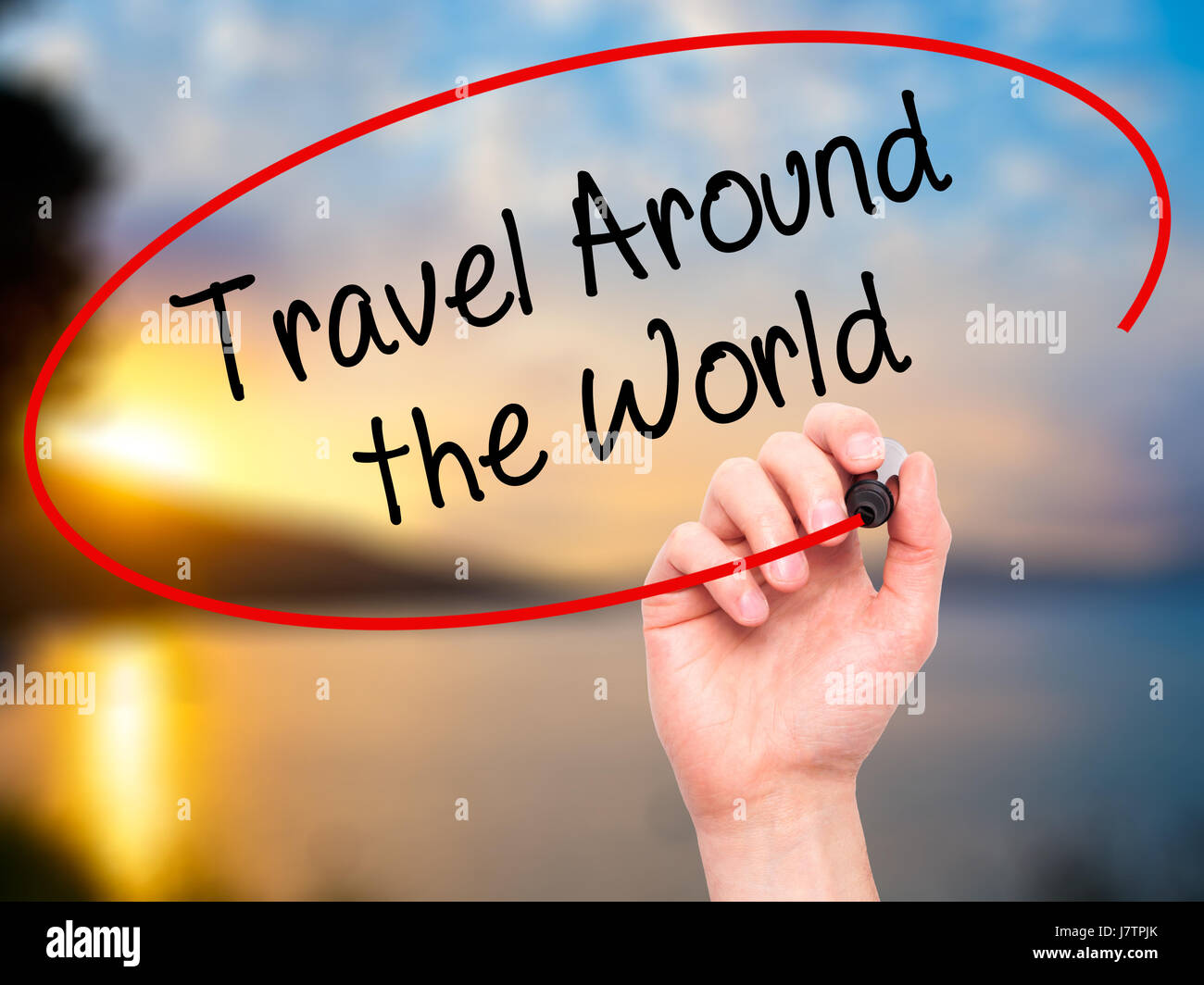 Man Hand writing Travel Around the World with black marker on visual ...
