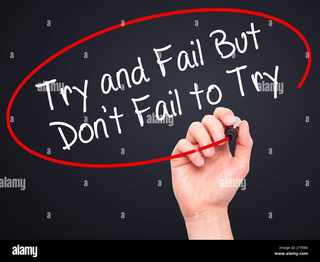 Man Hand writing Try and Fail But Don't Fail to Try with black marker ...