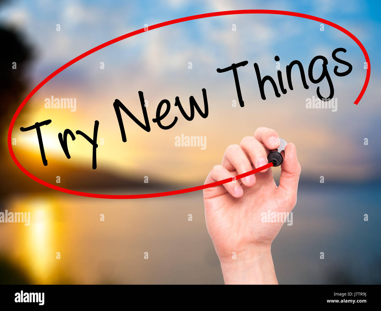 Man Hand writing Try New Things with black marker on visual screen ...