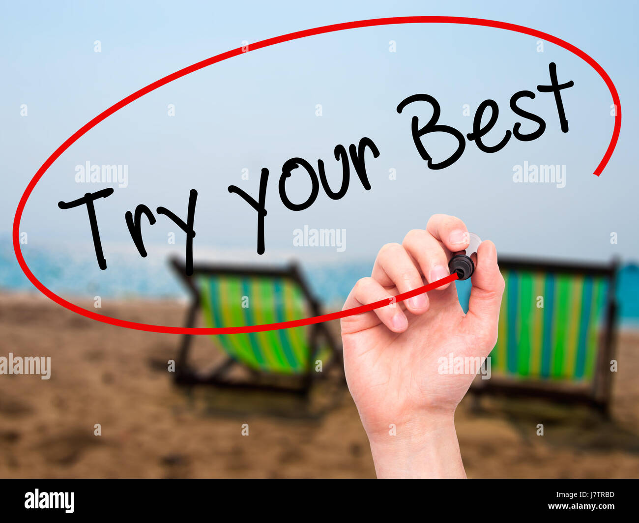 Man Hand writing Try your Best with black marker on visual screen ...