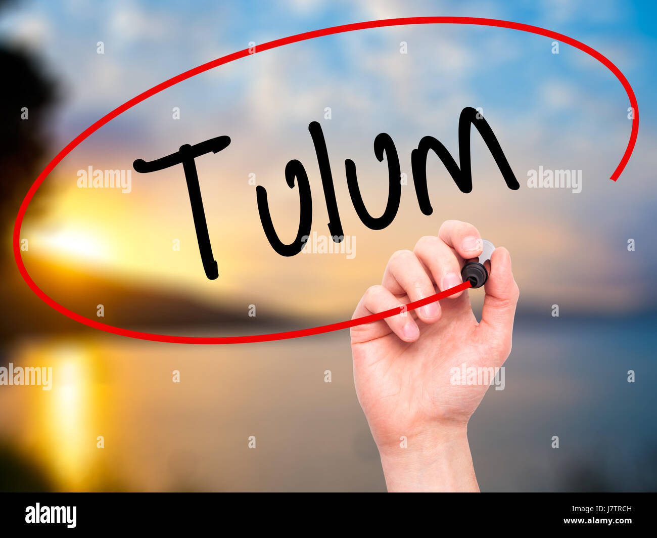 Man Hand writing Tulum with black marker on visual screen. Isolated on ...