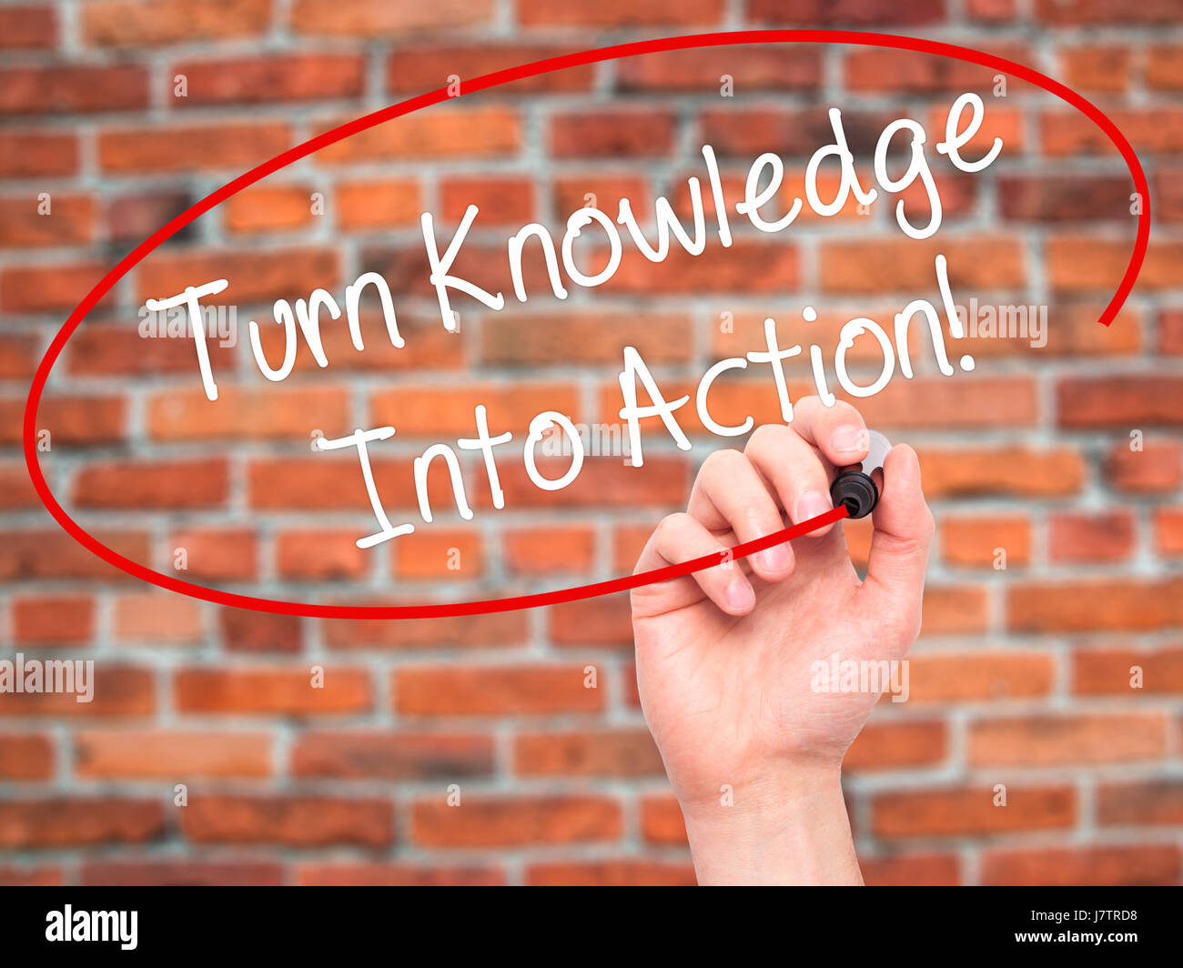 Man Hand writing Turn Knowledge Into Action! with black marker on ...