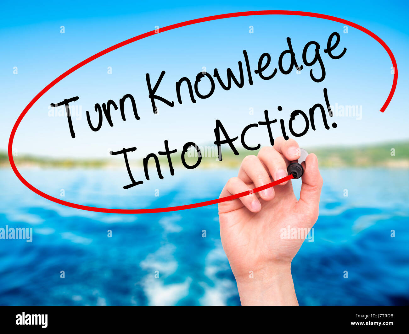 Man Hand writing Turn Knowledge Into Action! with black marker on ...