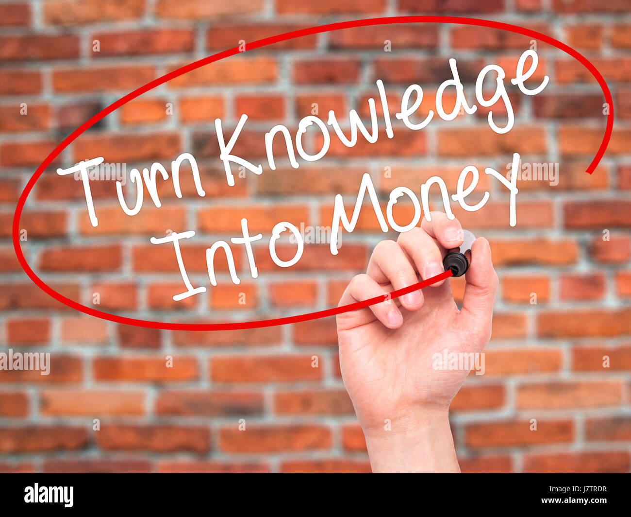 Man Hand writing Turn Knowledge Into Money with black marker on visual ...