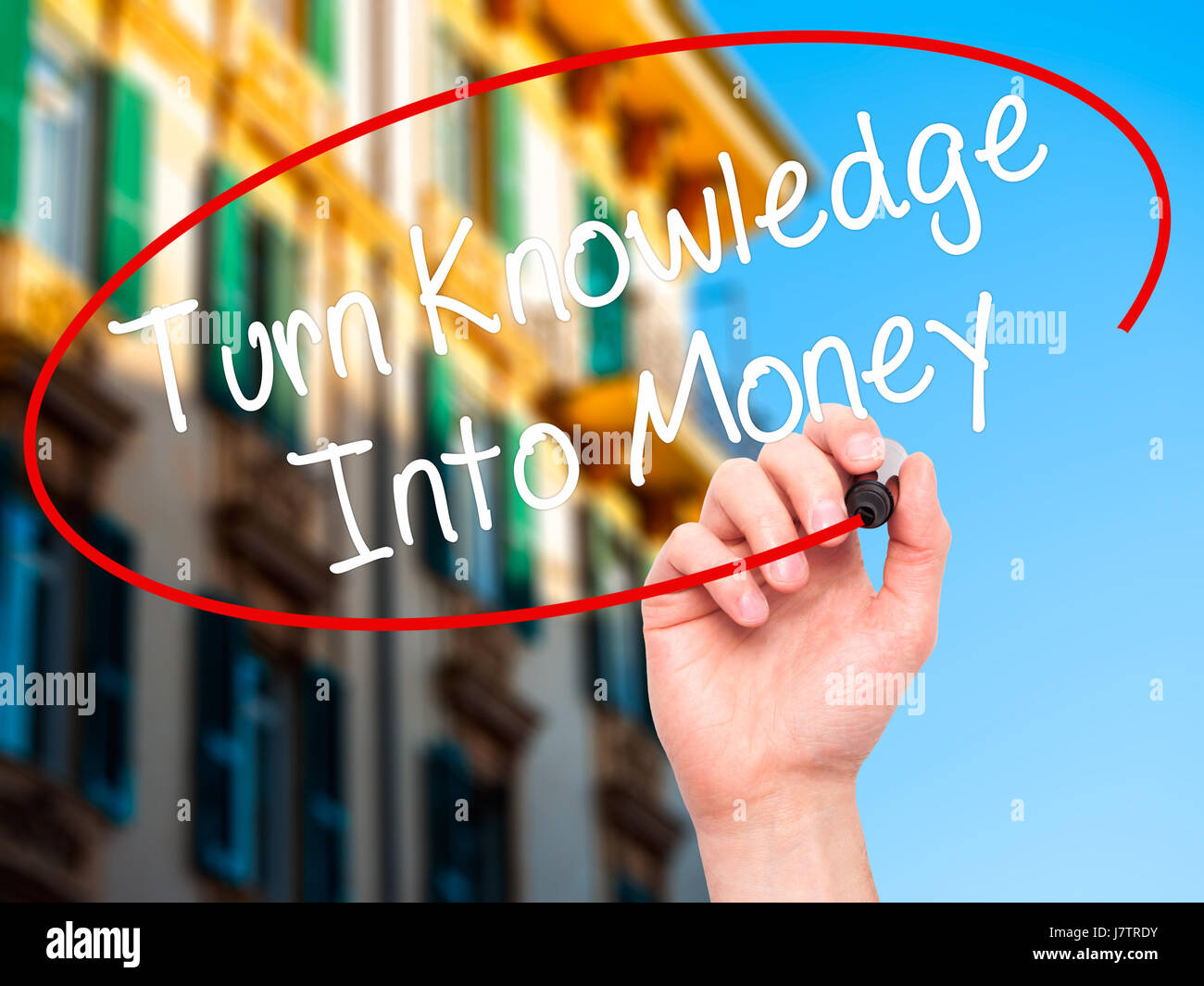 Man Hand writing Turn Knowledge Into Money with black marker on visual ...