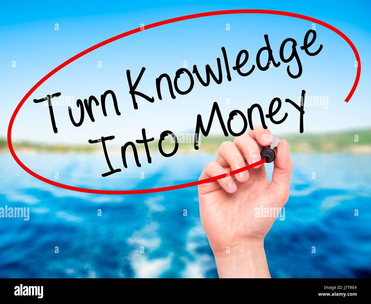 Man Hand writing Turn Knowledge Into Money with black marker on visual ...