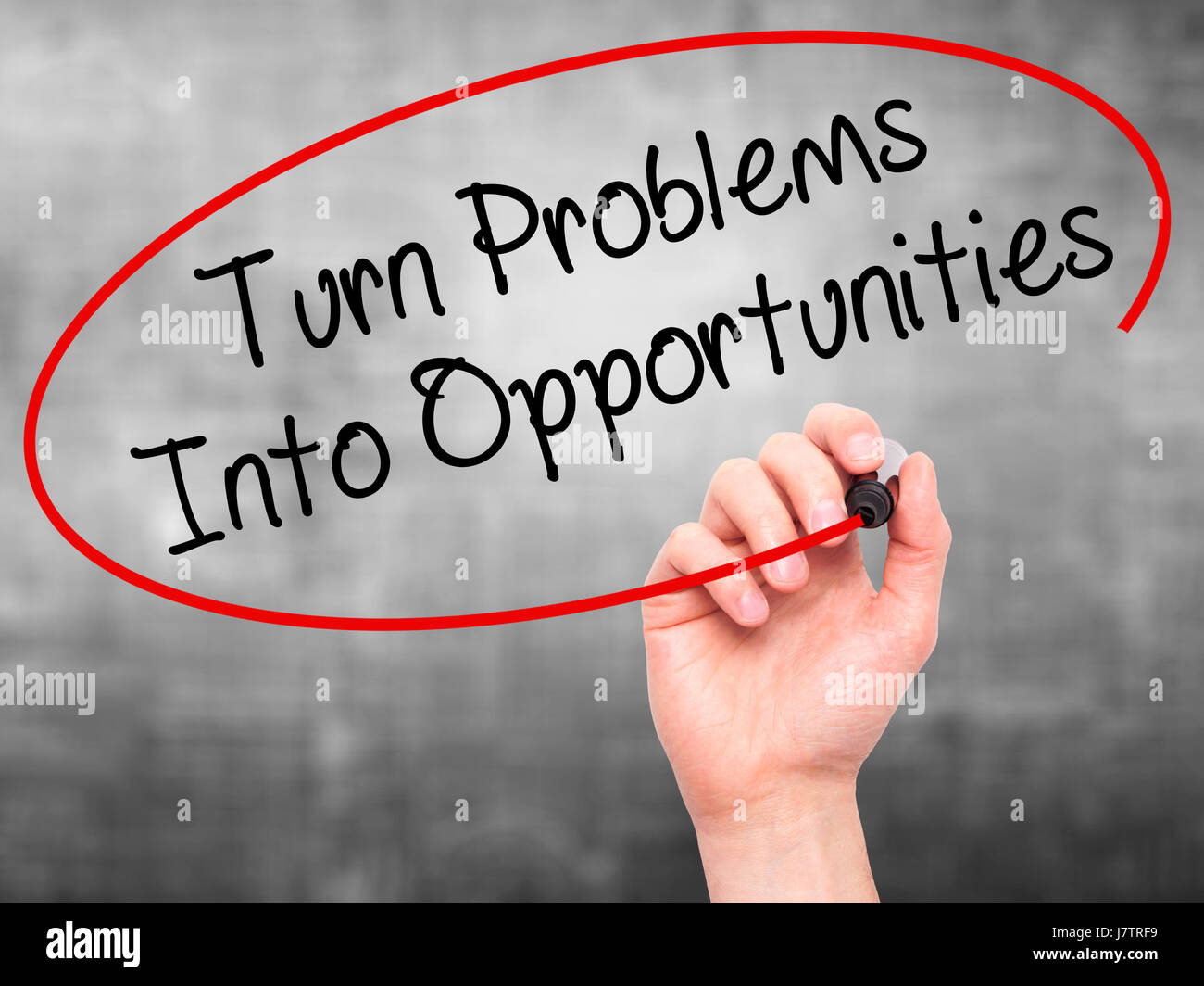 Man Hand writing Turn Problems into Opportunities with black marker on ...