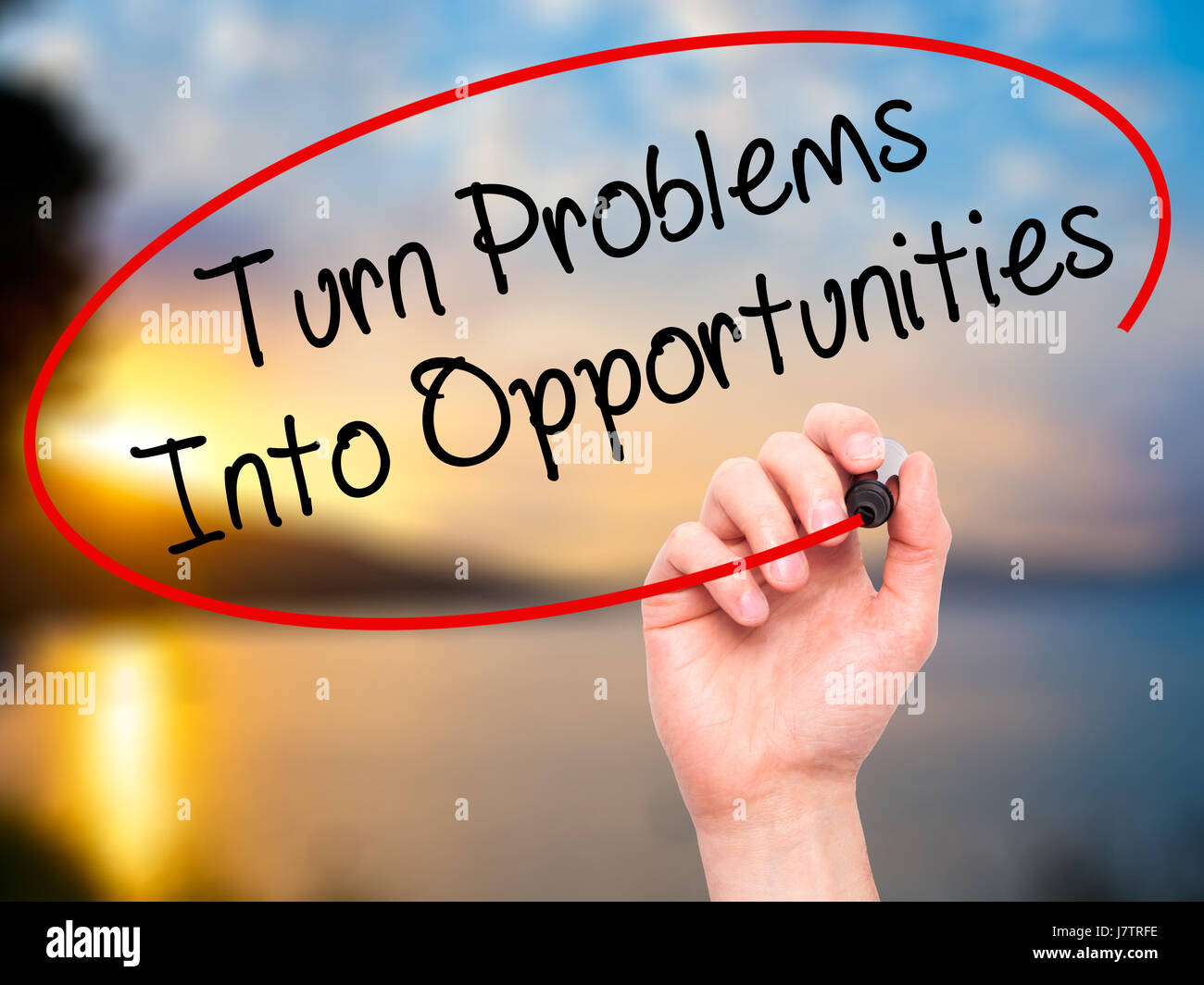 Man Hand writing Turn Problems into Opportunities with black marker on ...
