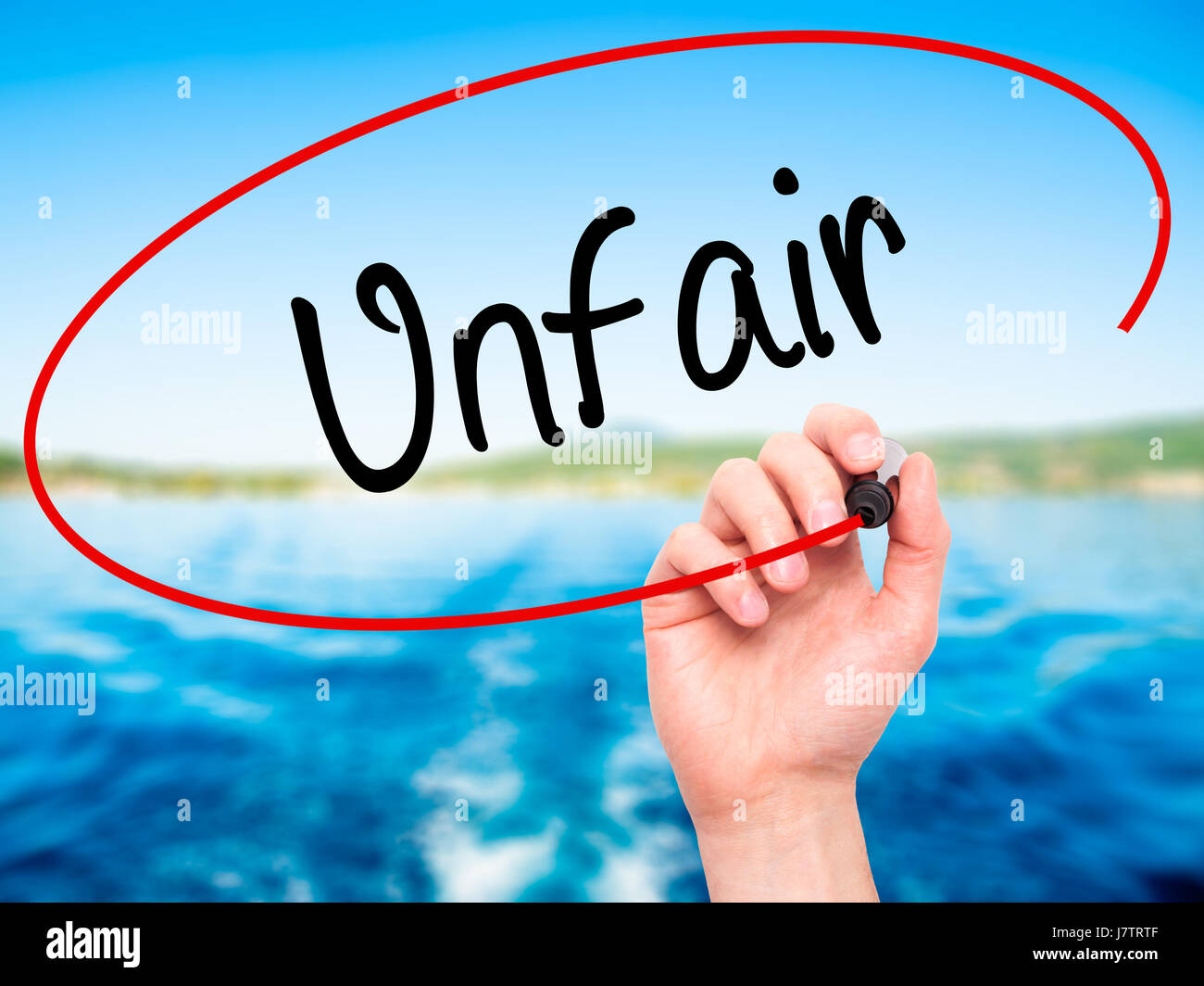 Man Hand writing Unfair with black marker on visual screen. Isolated on ...