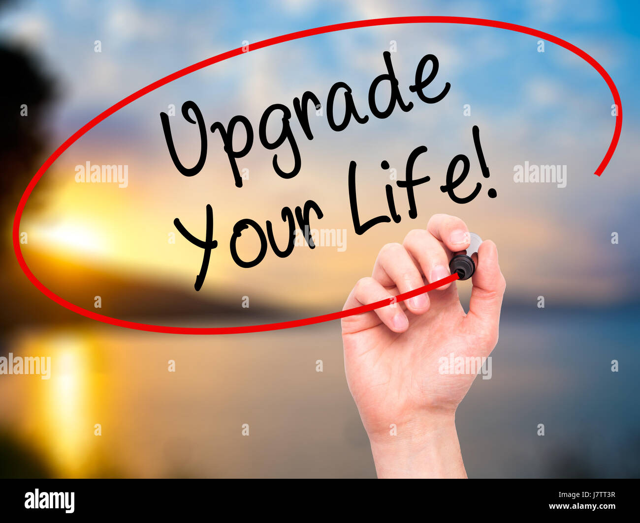 Man Hand writing Upgrade Your Life! with black marker on visual screen ...