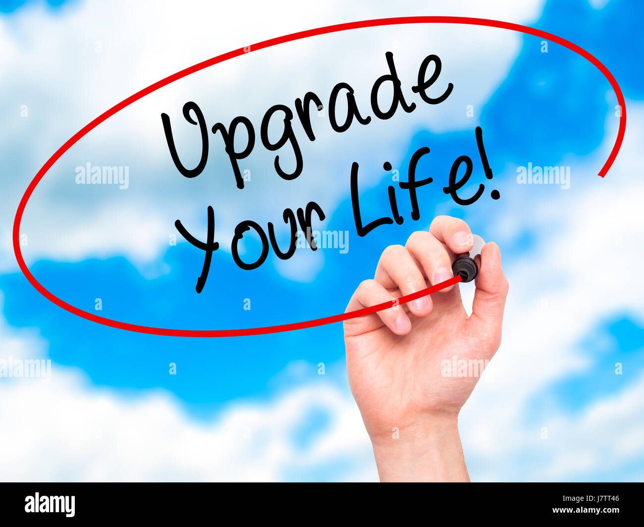 Man Hand writing Upgrade Your Life! with black marker on visual screen ...